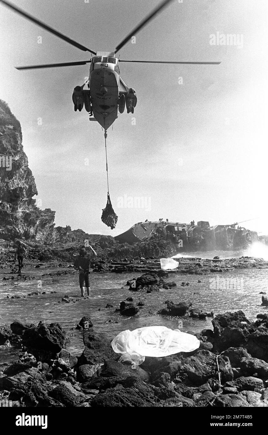 An underside view, looking toward the rear, of an SH-3A Sea King ...