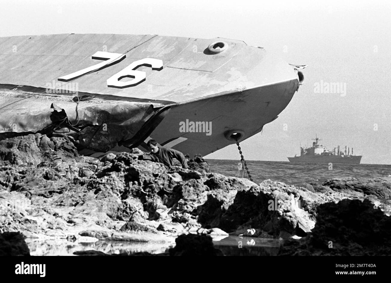 The damaged bow of the beached and overturned Filipino frigate RPS DATU ...