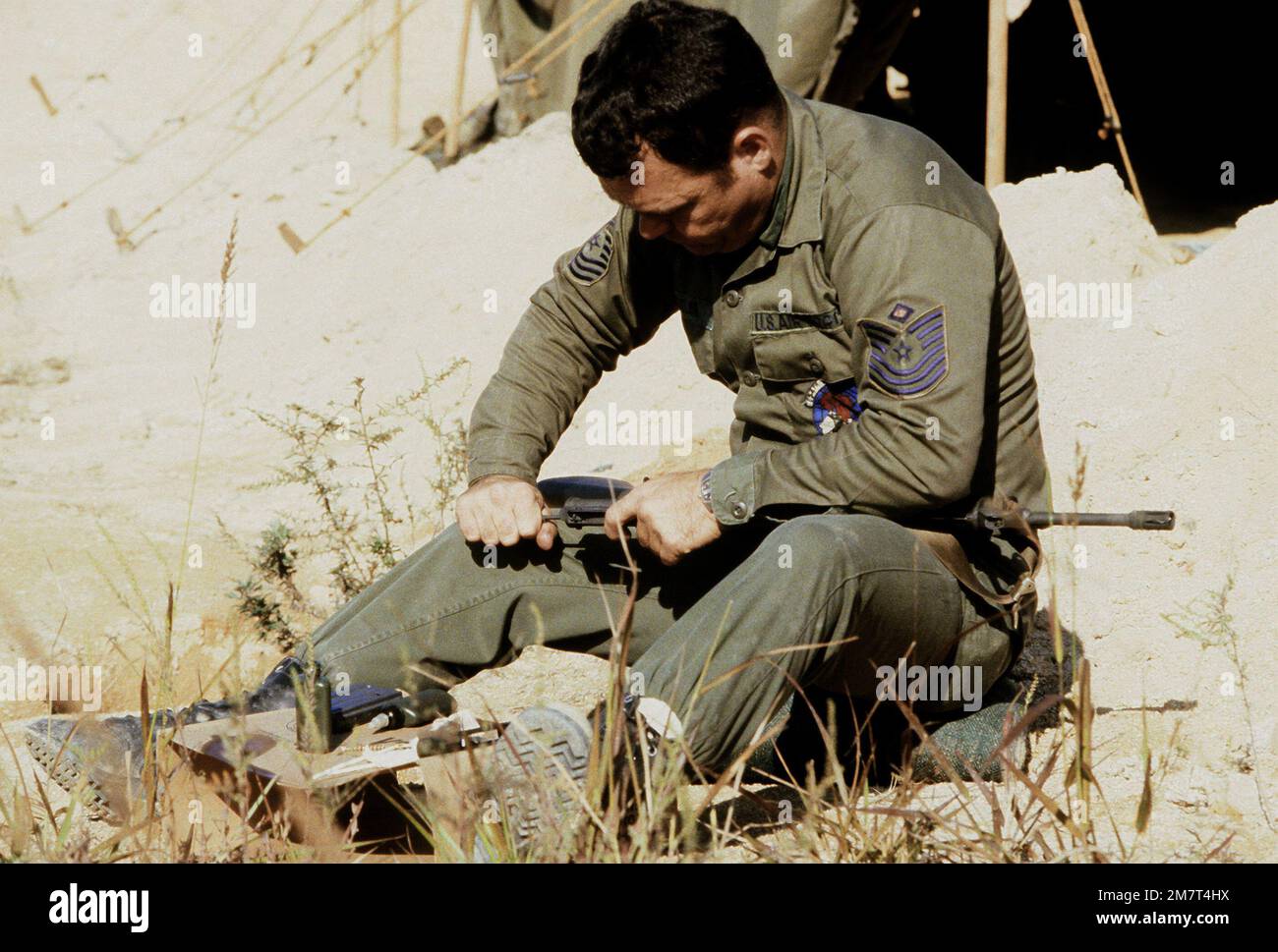 MSGT Robert Taylor of the 554th Civil Engineering Squadron cleans his M ...
