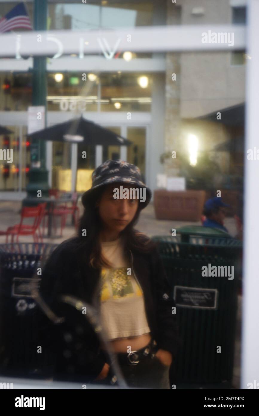 This photo is taken with the model in the background of a reflection ...