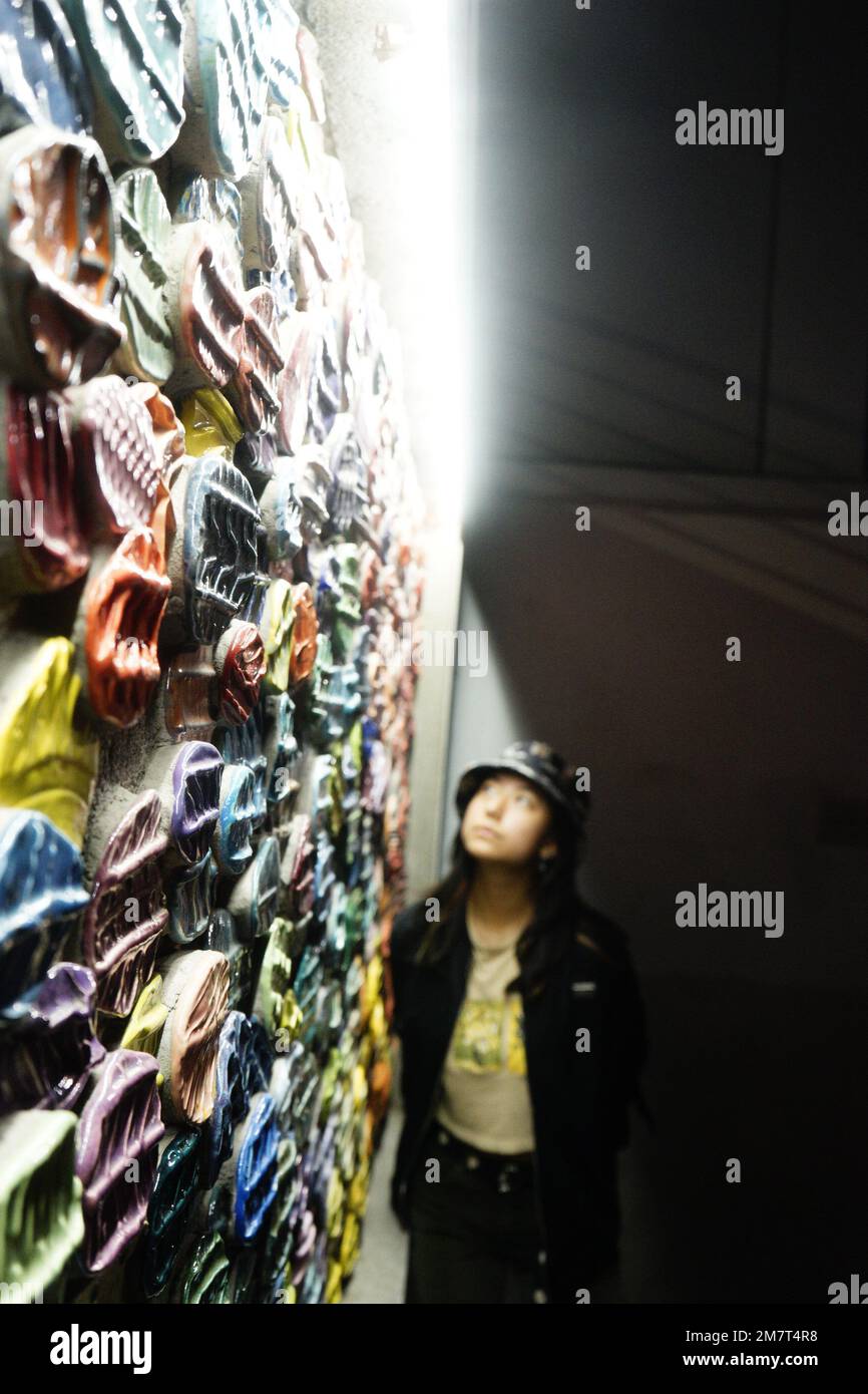 The model is placed under a light with the model in focus. Shot at low ...