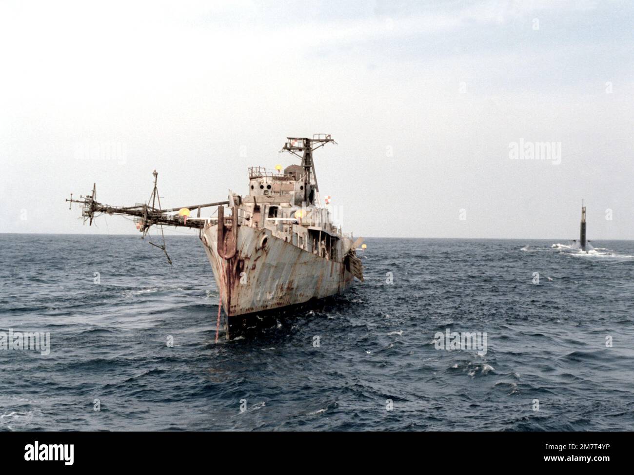 The periscope of the submarine HMS COURAGEOUS (S-106) is up, right, as ...