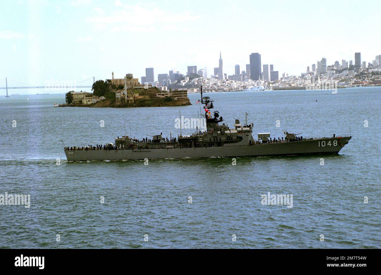 A starboard beam view of the frigate USS SAMPLE (FF-1048) underway ...
