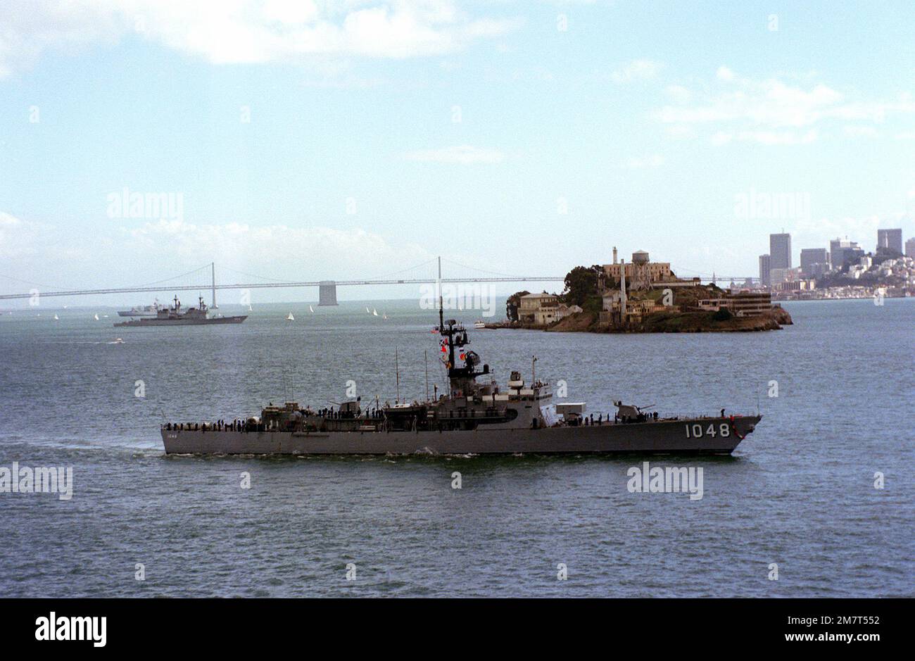 A starboard beam view of the frigate USS SAMPLE (FF-1048) underway ...