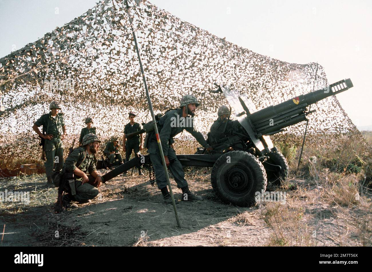 Spanish Marines man a 105mm howitzer during Exercise Crisex '81 ...