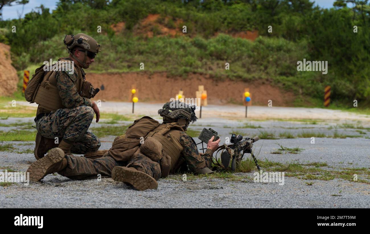 A U.S. Marine with 3d Battalion, 2nd Marines places an M18 Claymore ...