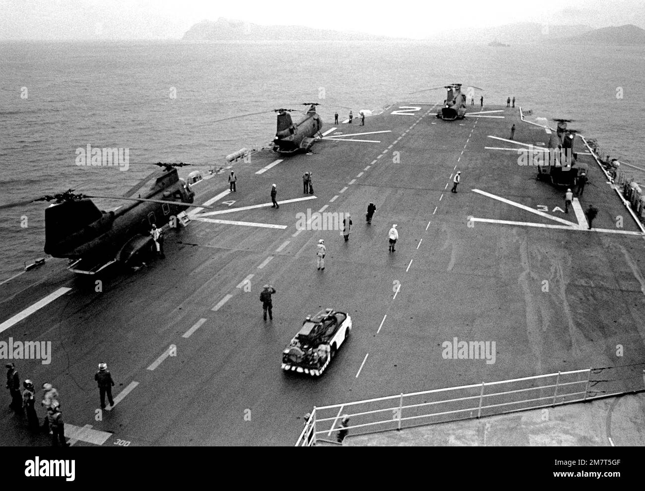 Elevated view of four CH-46 Sea Knight helicopters parked on the deck ...