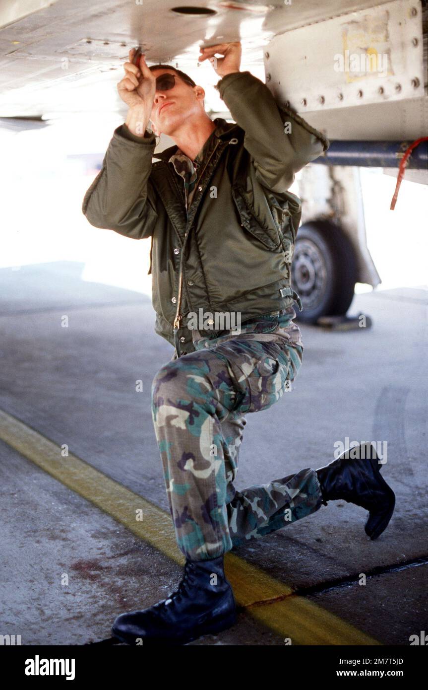 Sergeant Arnold of Marine Aircraft Group 41 works on an F-4 Phantom II ...