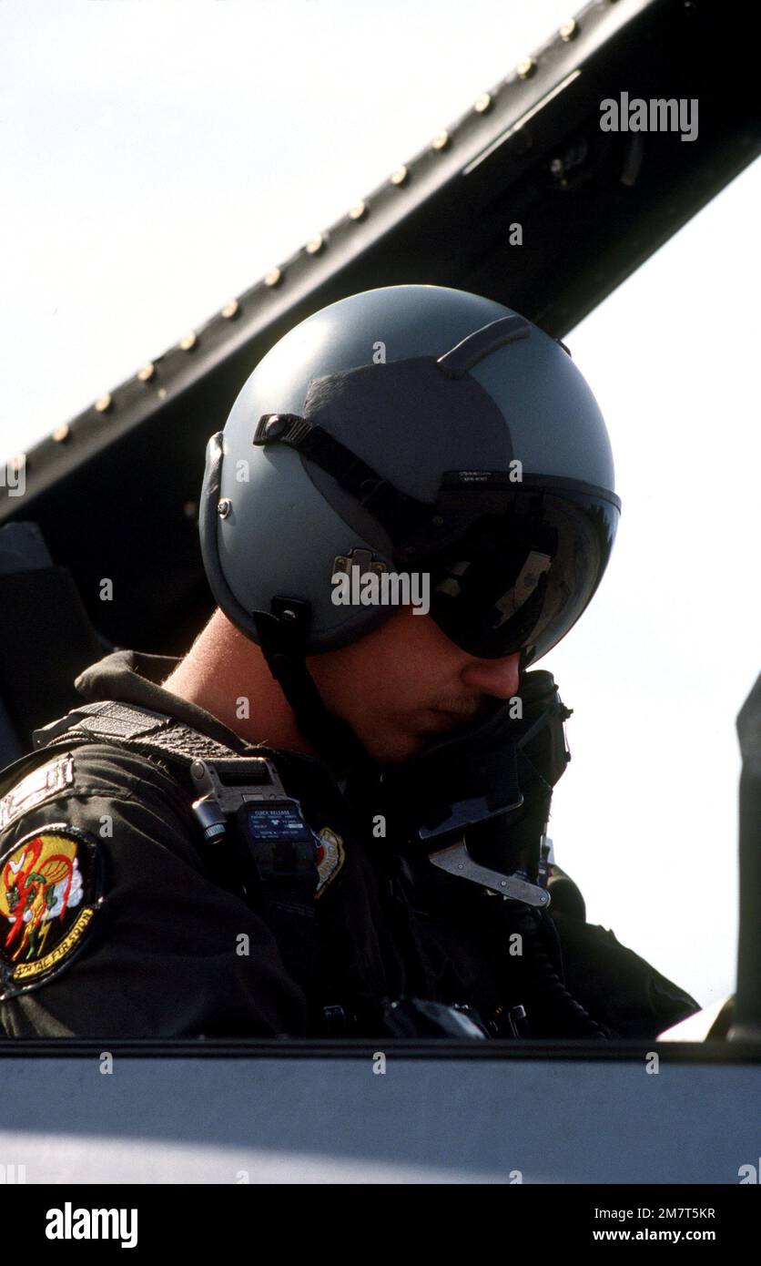 Captain Lee Halverson prepares for flight in the cockpit of his F-16 ...