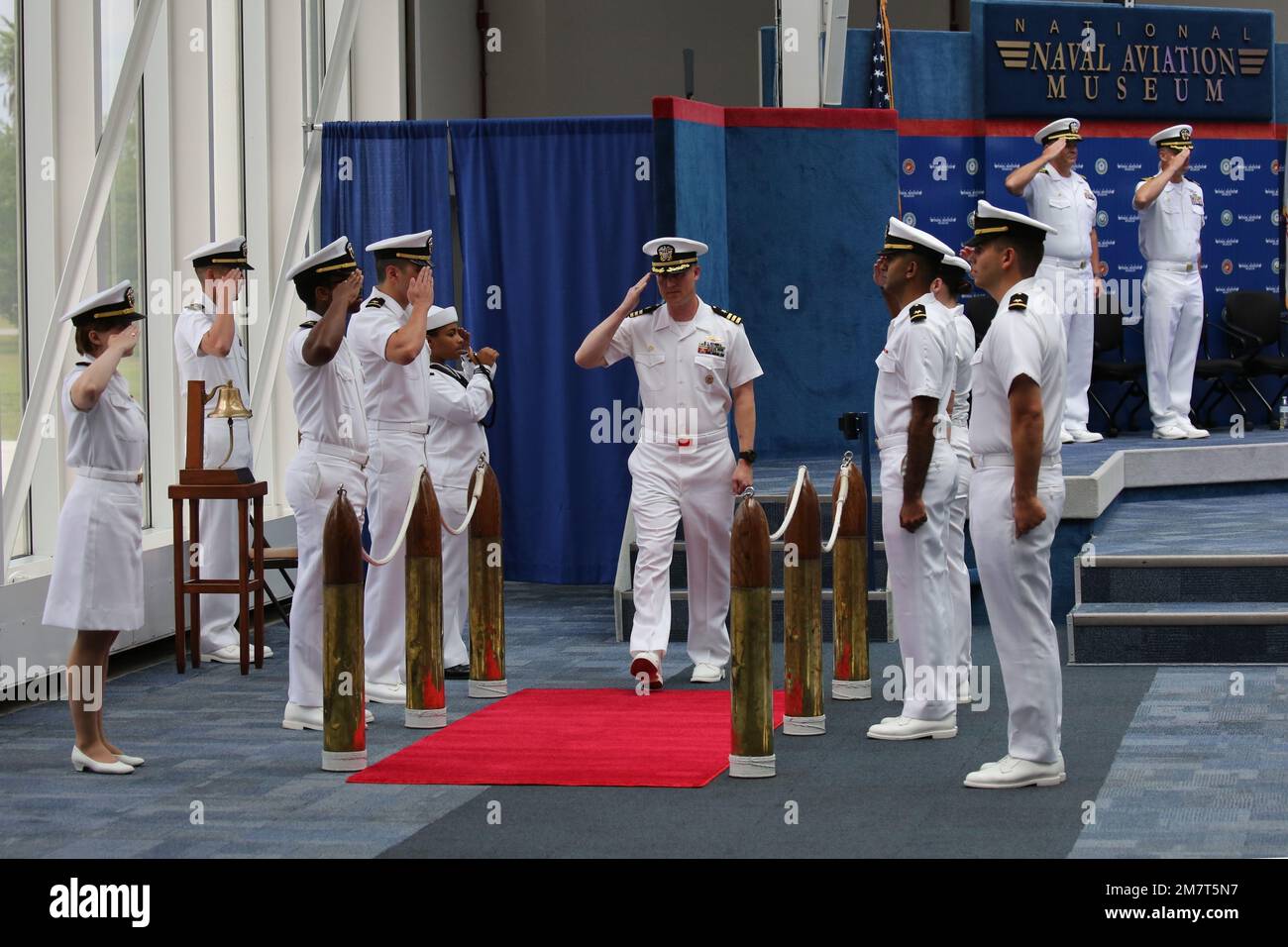 Cmdr. John Gleason is piped ashore as the new commanding officer to the ...