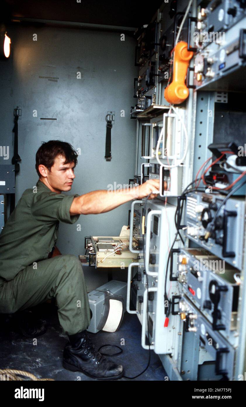 Sergeant Edward Irvine, 728th Tactical Control Squadron, replaces parts ...