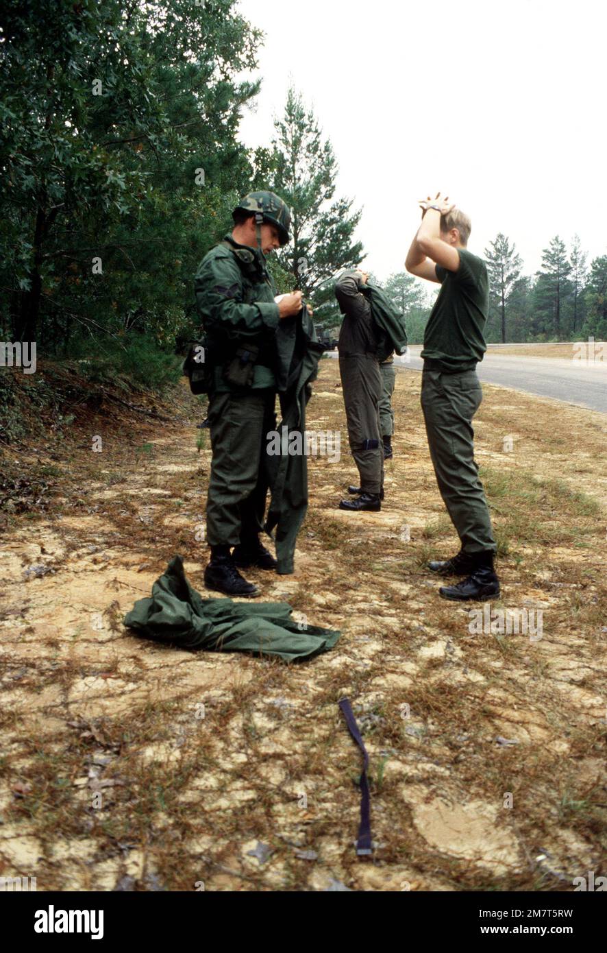 Prisoners of war are searched for weapons and documents at the entry ...
