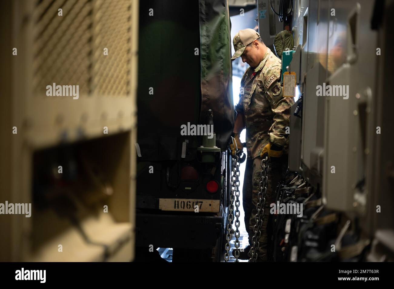 Tech. Sgt. Josh Moracco, 204th Airlift Squadron loadmaster, secures U.S ...