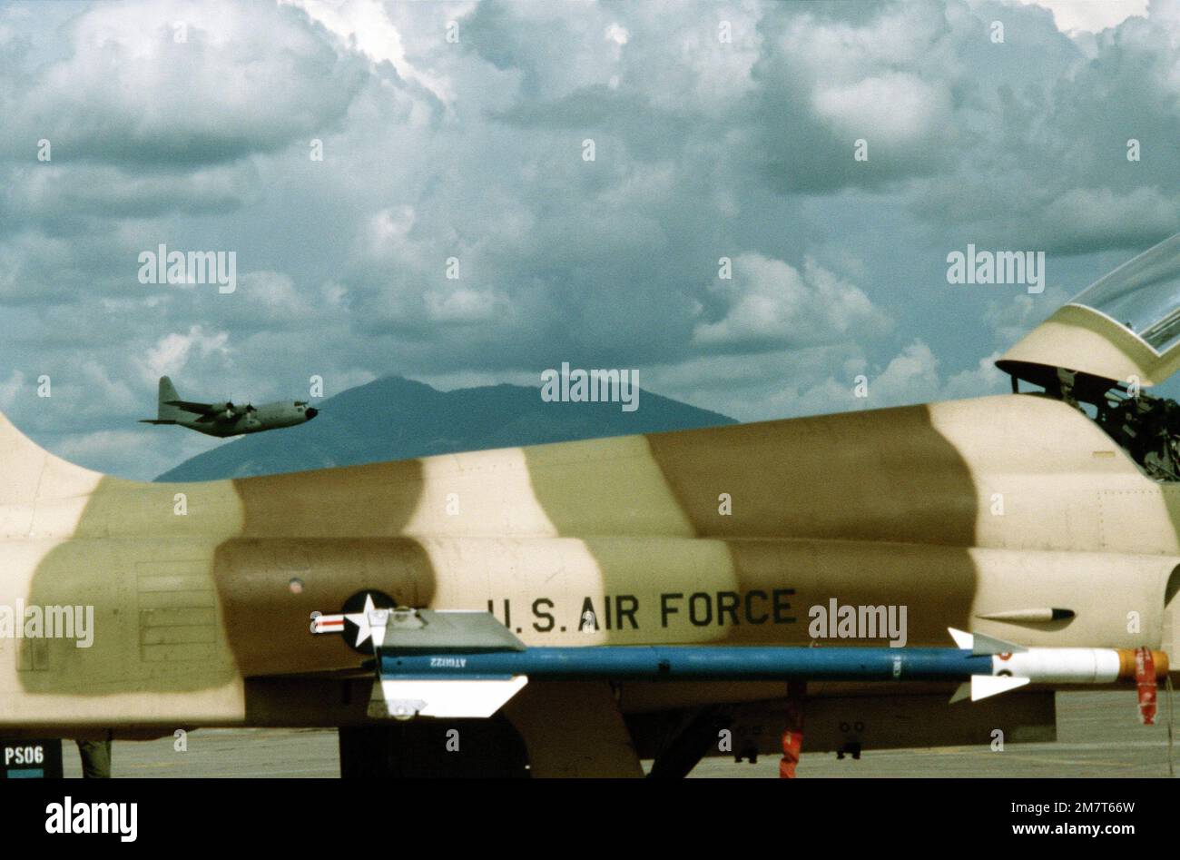 An AIM-9 Sidewinder missile installed on the right wingtip launcher of ...