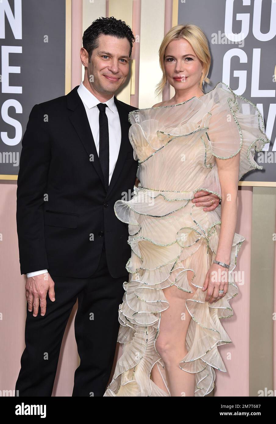 Thomas Kail, left, and Michelle Williams arrive at the 80th annual ...