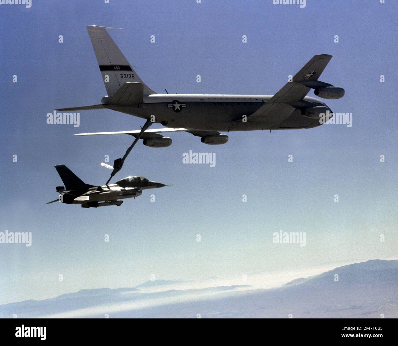 An air-to-air right rear view of a KC-135 Stratotanker aircraft ...