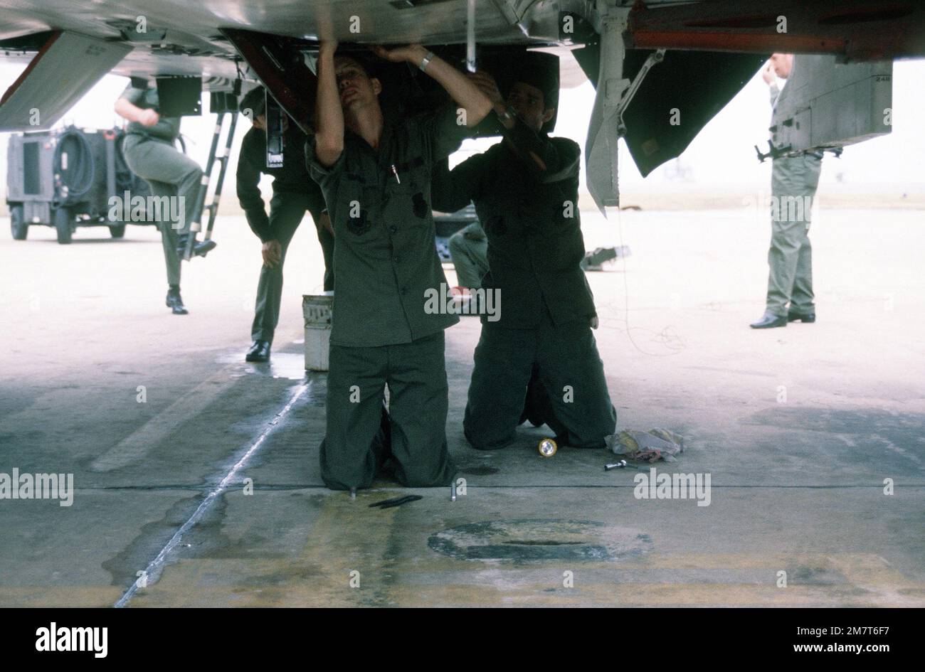 Maintenance crewmen from the Eighth Tactical Fighter Wing make a pre ...