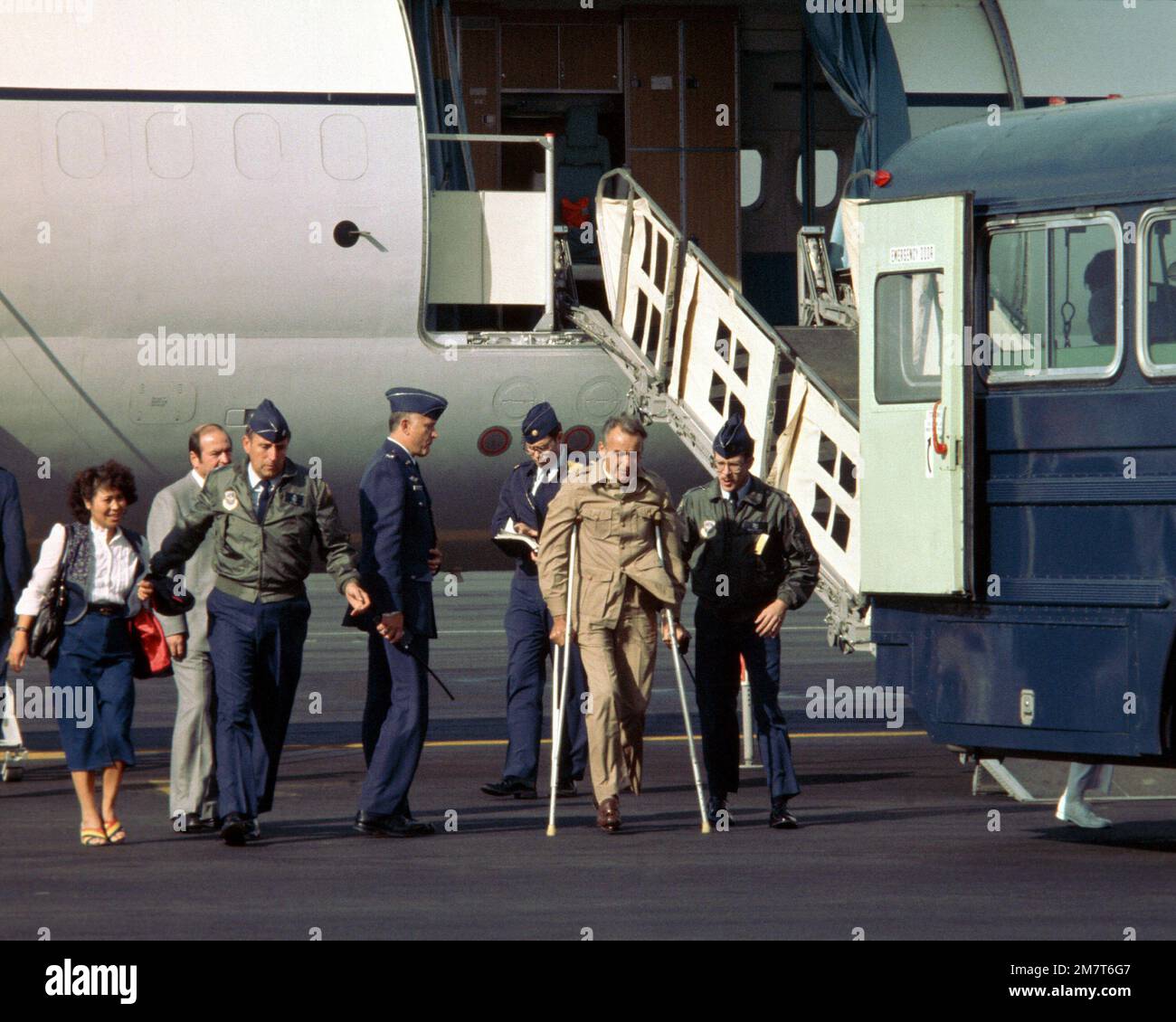 Fred Golden walks, with the aid of crutches, from a 55th Aeromedical ...