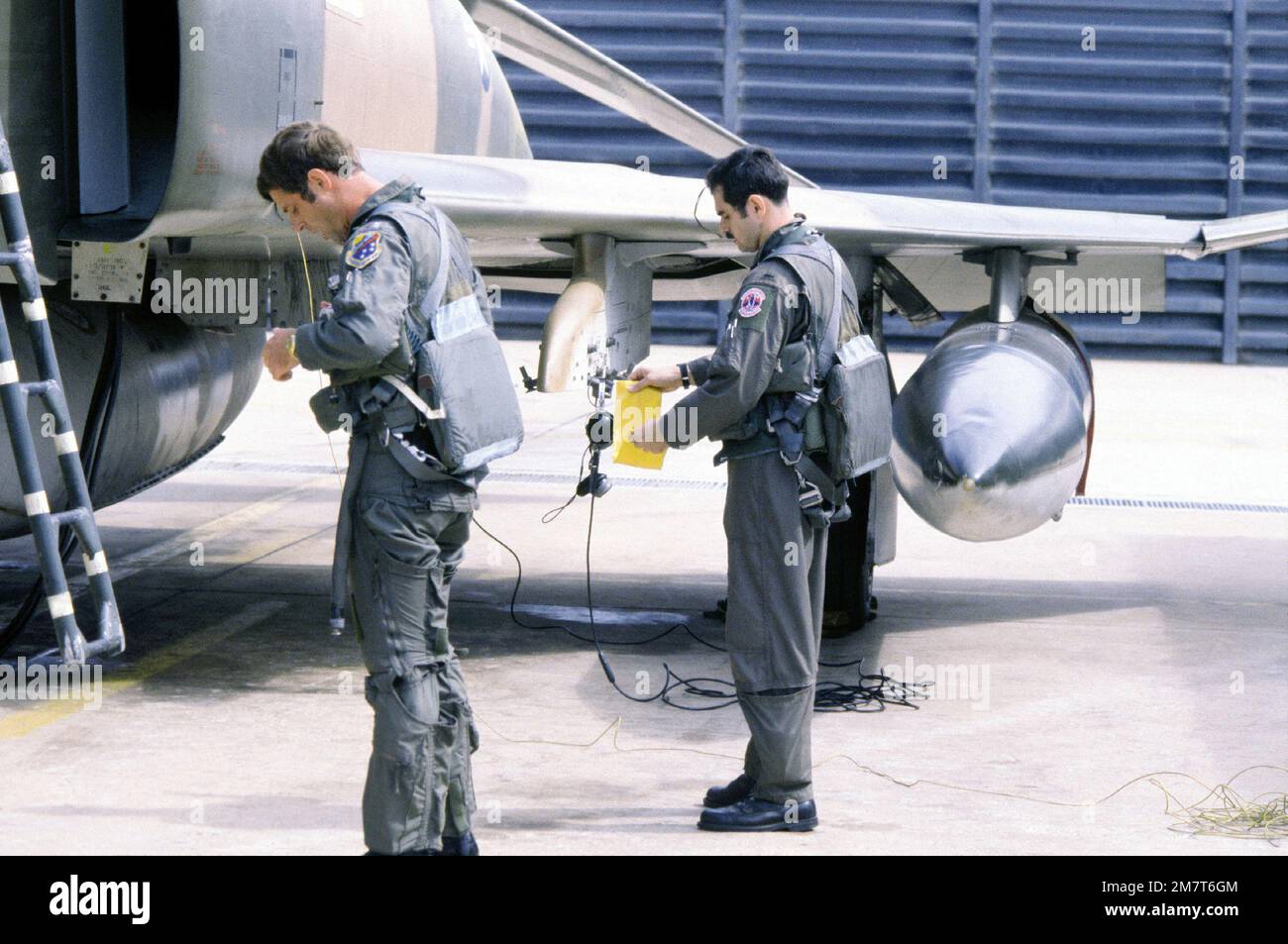 Flight crewmen prepare to board an F-4 Phantom II aircraft for its ...