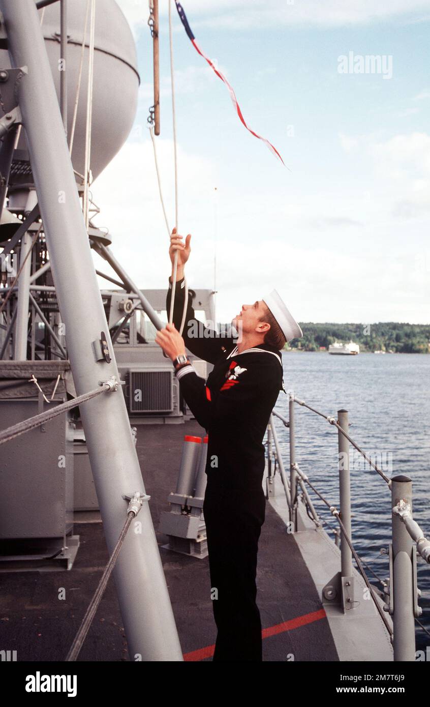 Puget Sound Naval Shipyard, Bremerton, Washington. A crewmember aboard ...