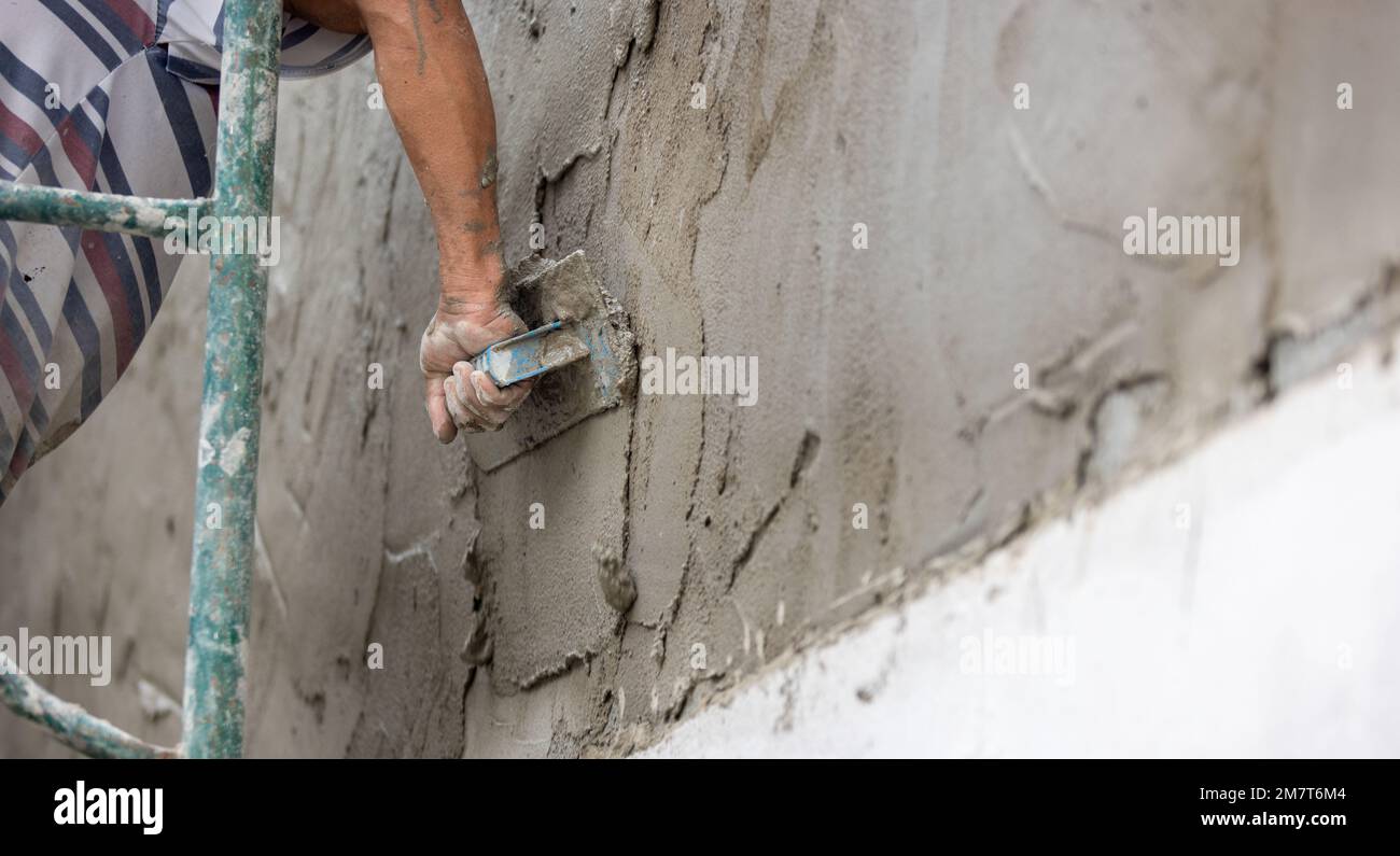 Unsafe construction of Myanmar migrant workers while plastering a wall ...