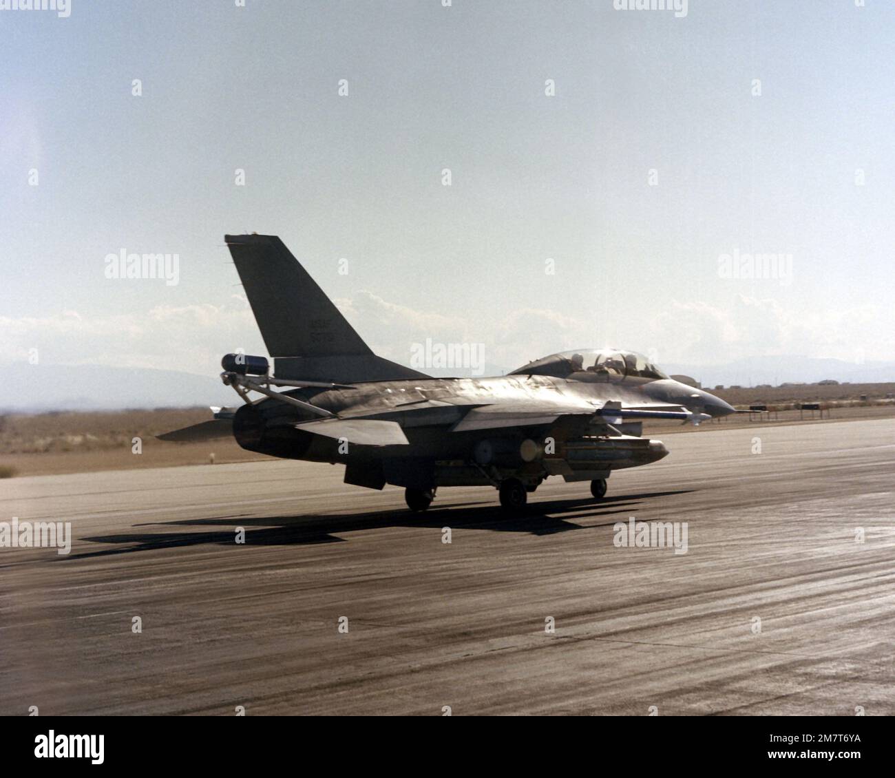 An F-16B Fighting Falcon aircraft takes off with a glide bomb mounted ...