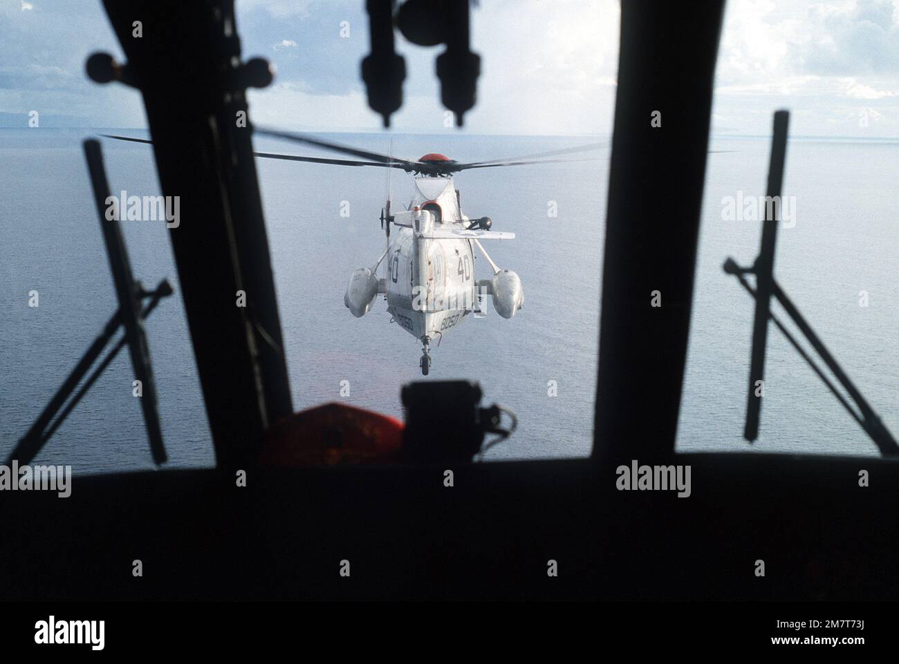 An air-to-air view of an SH-3 Sea King helicopter taken from the ...