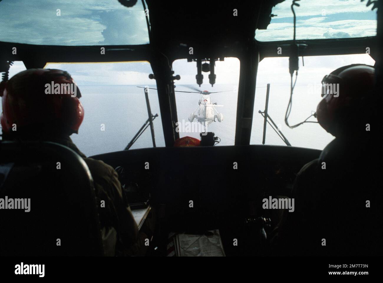 An air-to-air rear view of an SH-3 Sea King helicopter taken from the ...