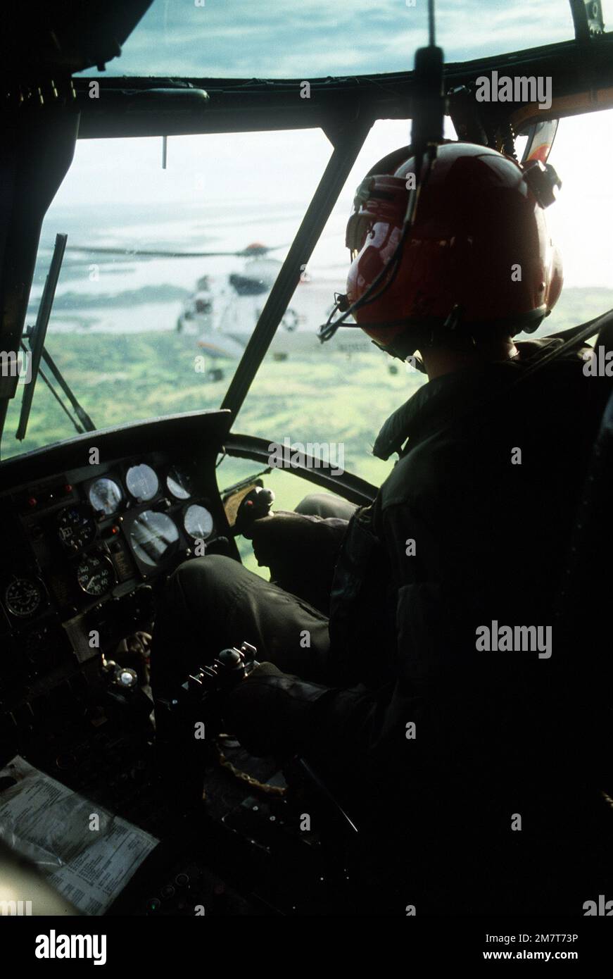 An air-to-air view of an SH-3 Sea King helicopter taken from the ...