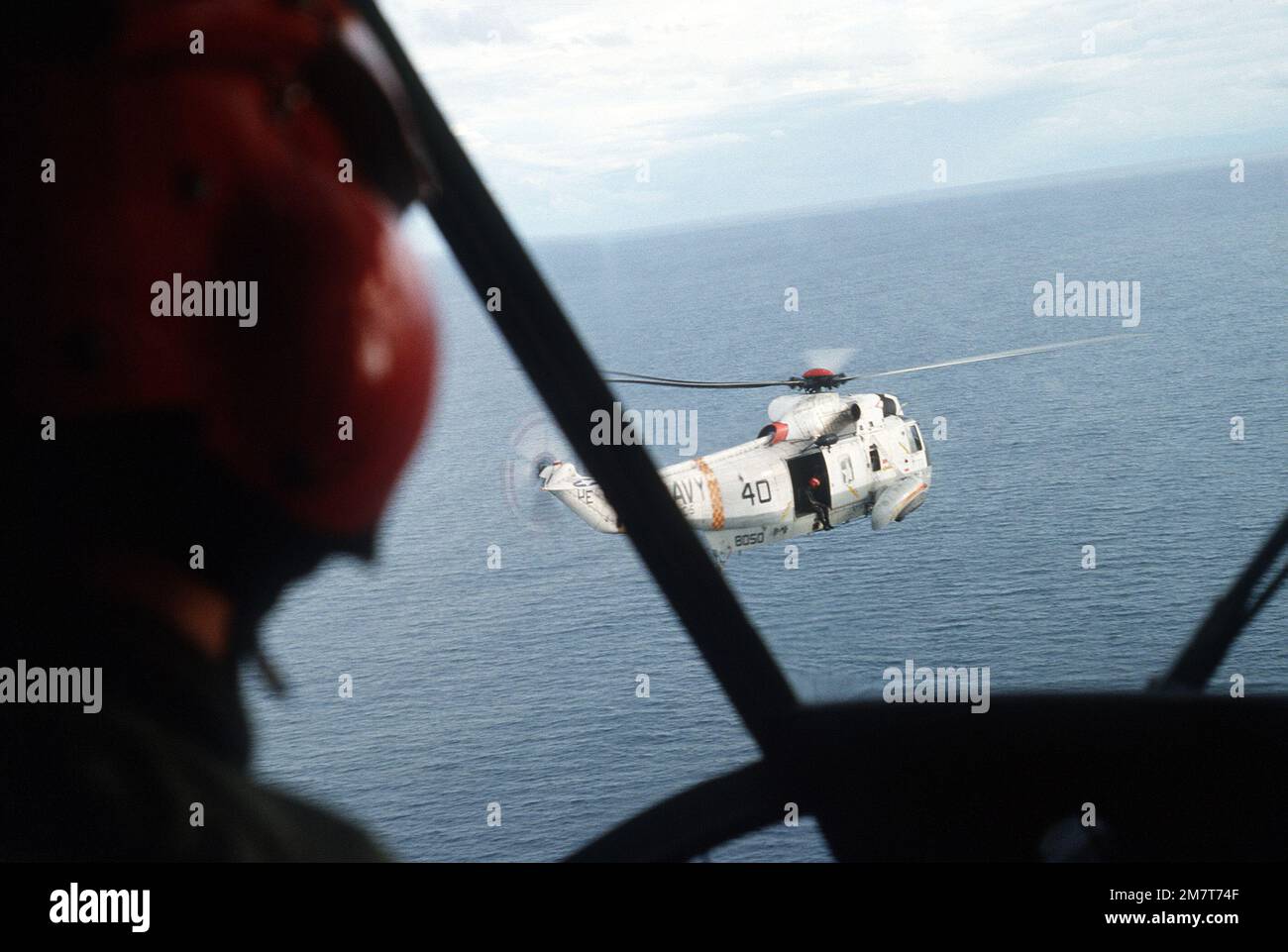 An air-to-air view of an SH-3 Sea King helicopter taken from the ...