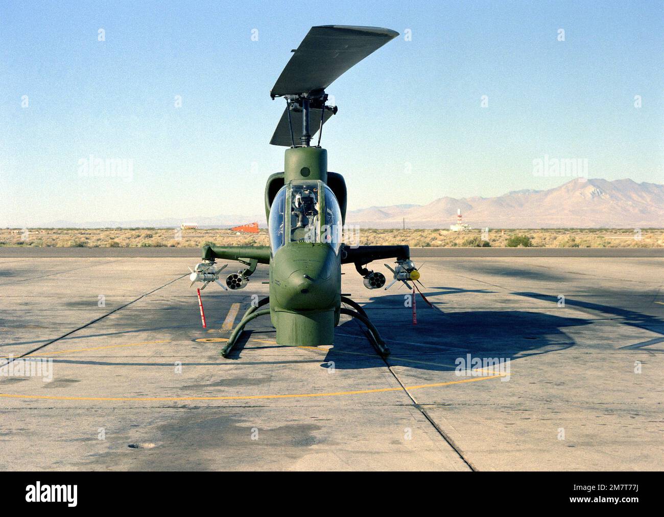 Front view of an AH-1 Sea Cobra helicopter armed with two Sidearm ...