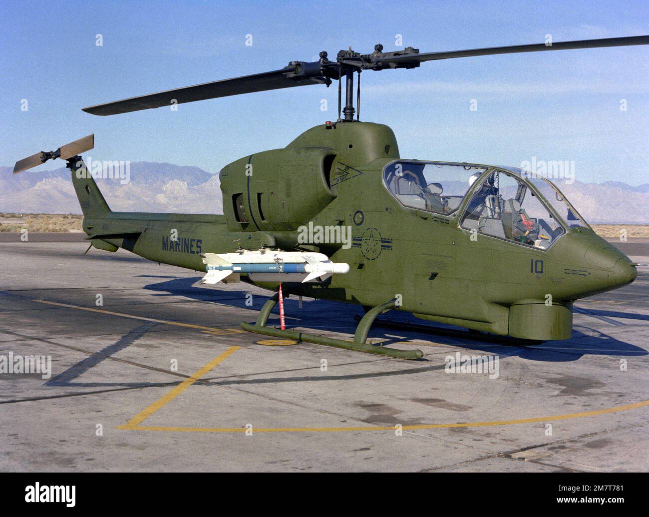 A right side view of an AH-1 Sea Cobra helicopter armed with a Sidearm ...