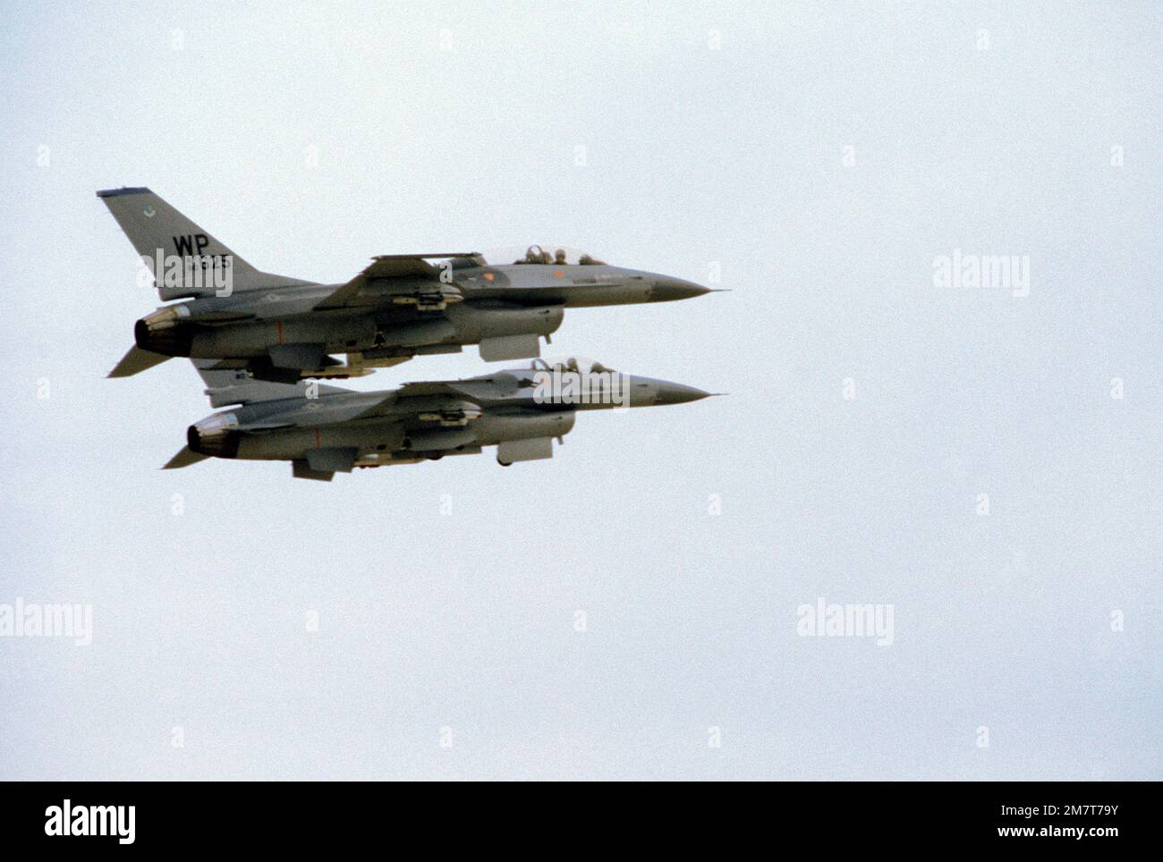 A right side view of two 8th Tactical Fighter Wing F-16 Fighting Falcon ...