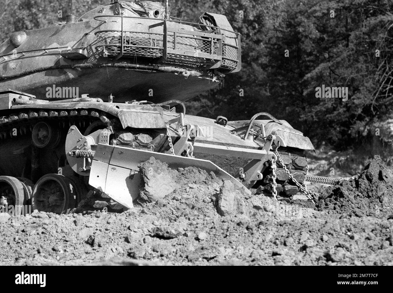 A right front view of an M60 main battle tank, equipped with a track ...
