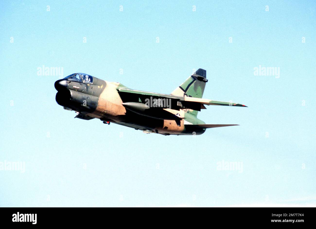 An air-to-air left front view of an A-7 Corsair II aircraft during ...