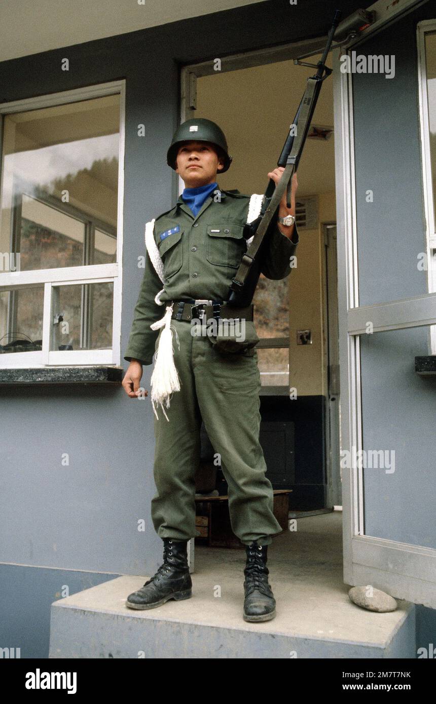 A Korean air force guard is on duty at the main gate of the Korean ...