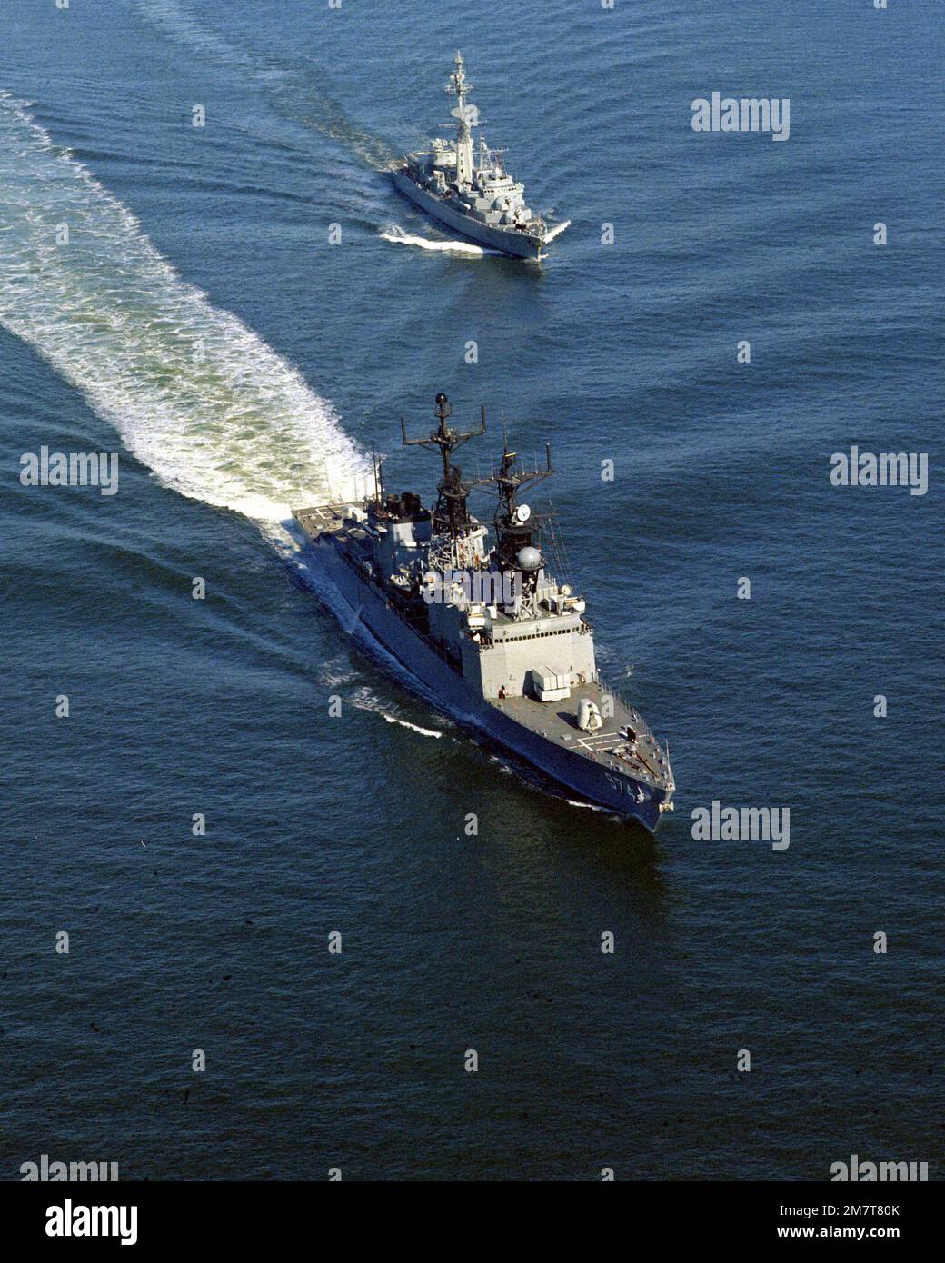 A starboard bow view of the destroyer USS COMTE DE GRASSE (DD-974) and ...