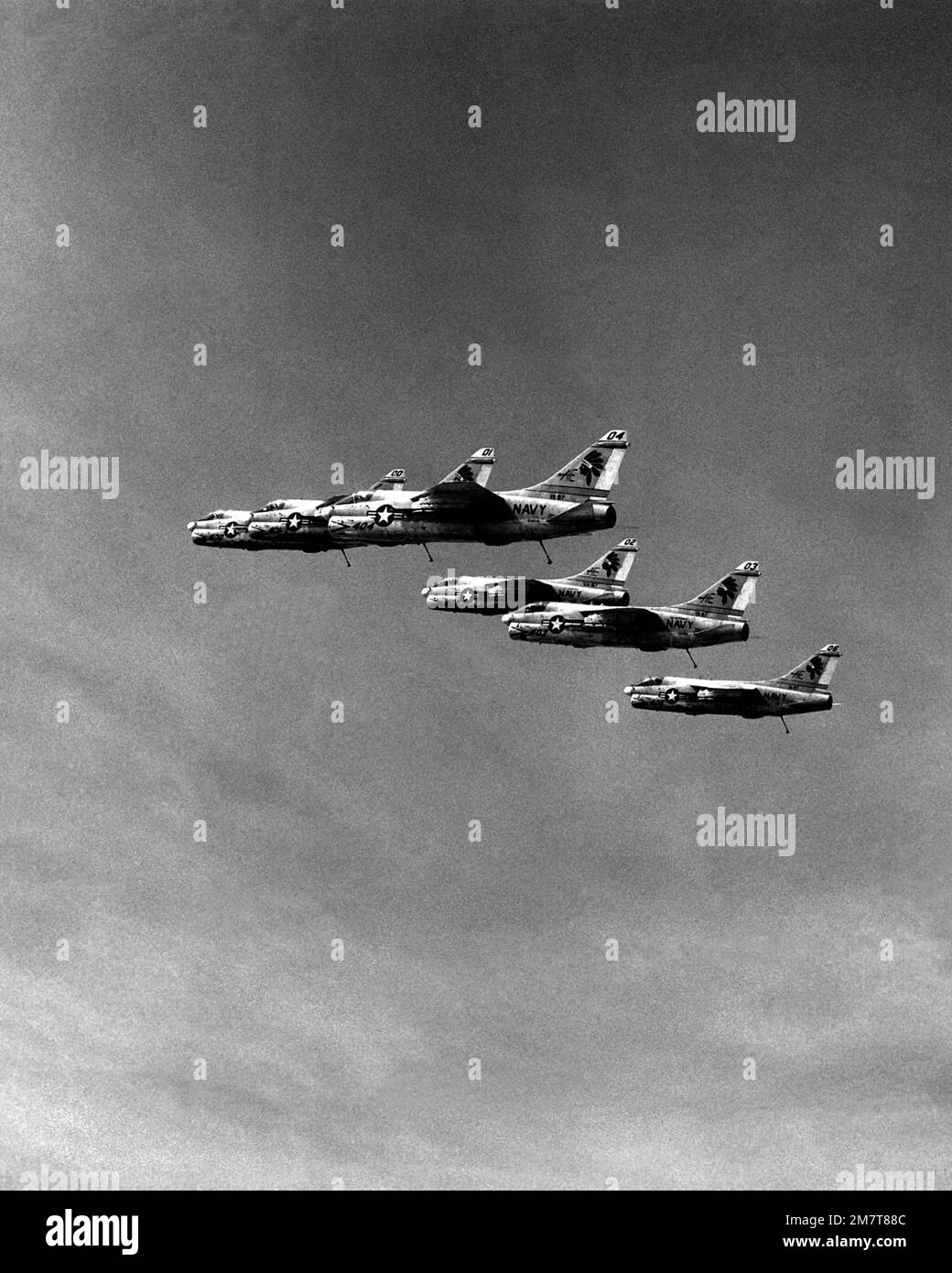An air-to-air left side view of six A-7E Corsair II aircraft from ...
