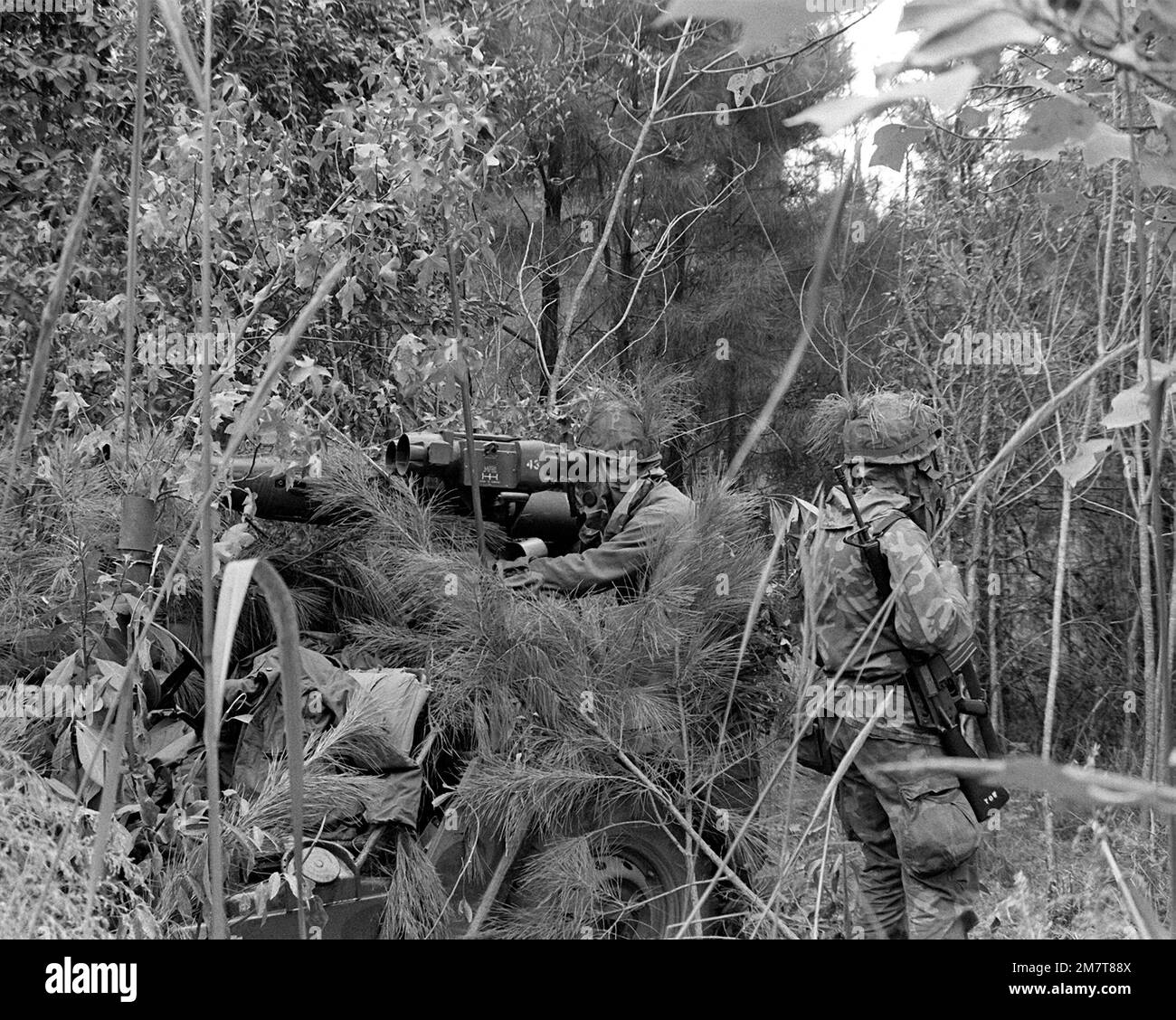 Members of the 8th Marines wearing protective clothing defend his ...