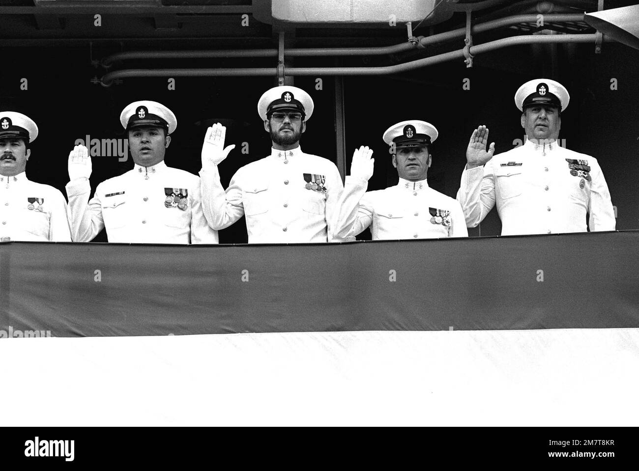 Five crewmen re-enlist during the commissioning ceremony for the guided ...