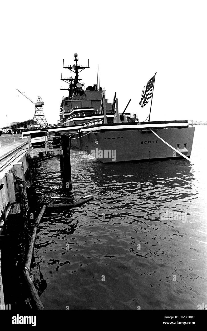 A stern view of the guided missile destroyer USS SCOTT (DDG-995) docked ...