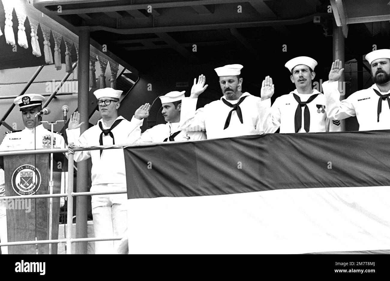 Crewmen are re-enlisted during the commissioning of the guided missile ...