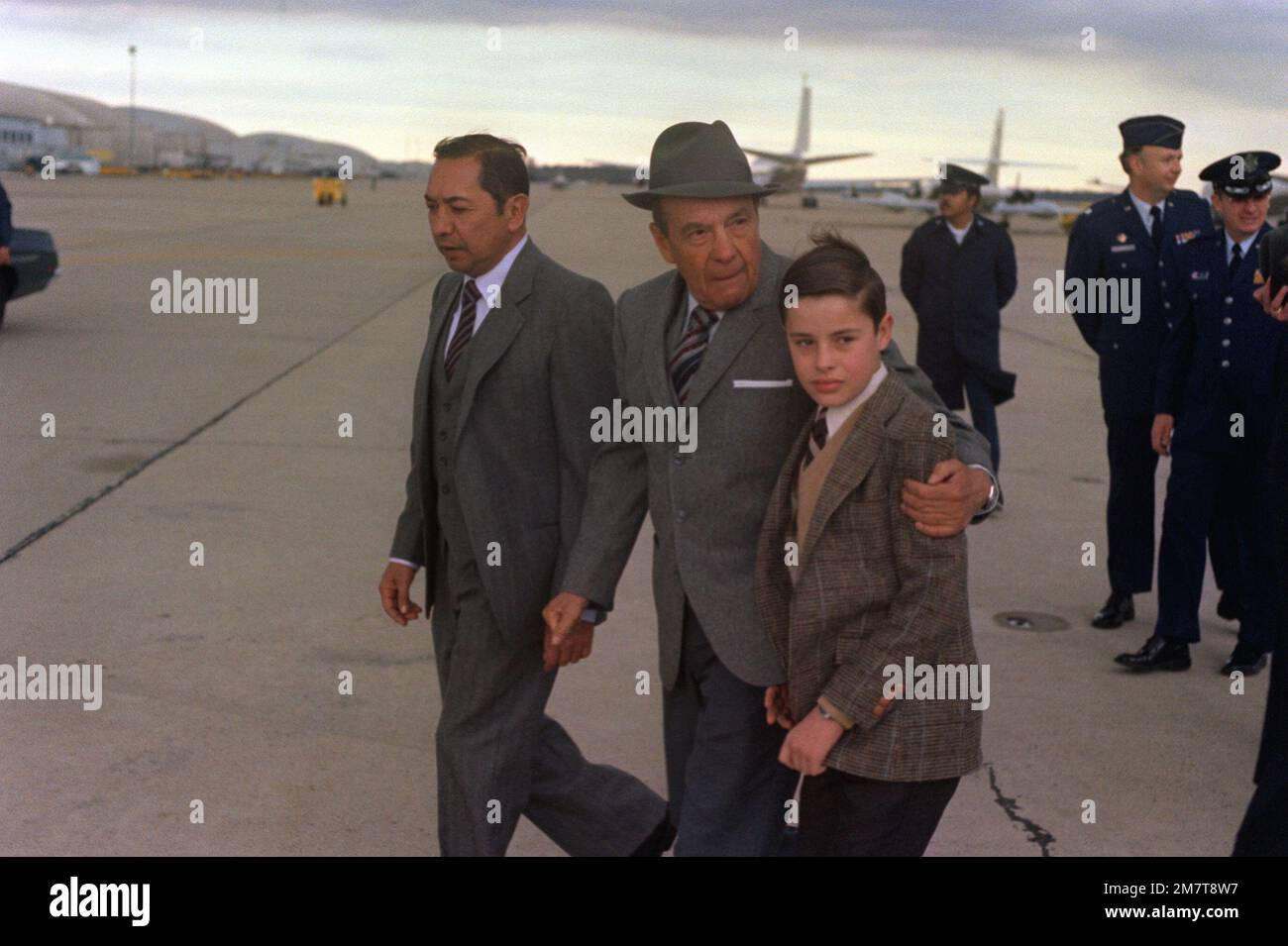 GEN Galvin of Mexico, center, walks toward the air terminal with his ...