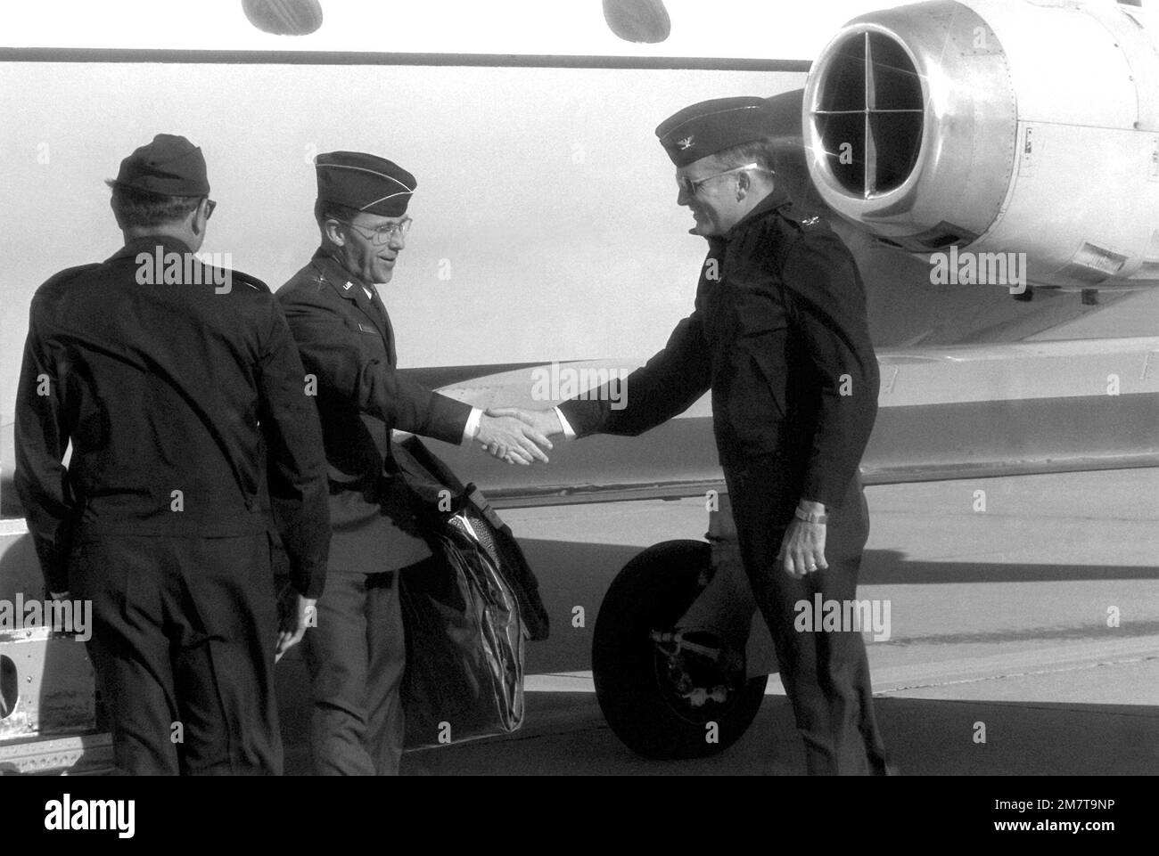 BGEN David L. Nichols (left), is greeted by air base wing commander ...