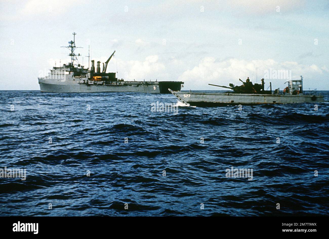An LCM-8 mechanized landing craft carriers an M-60A1 tank of the 31st ...