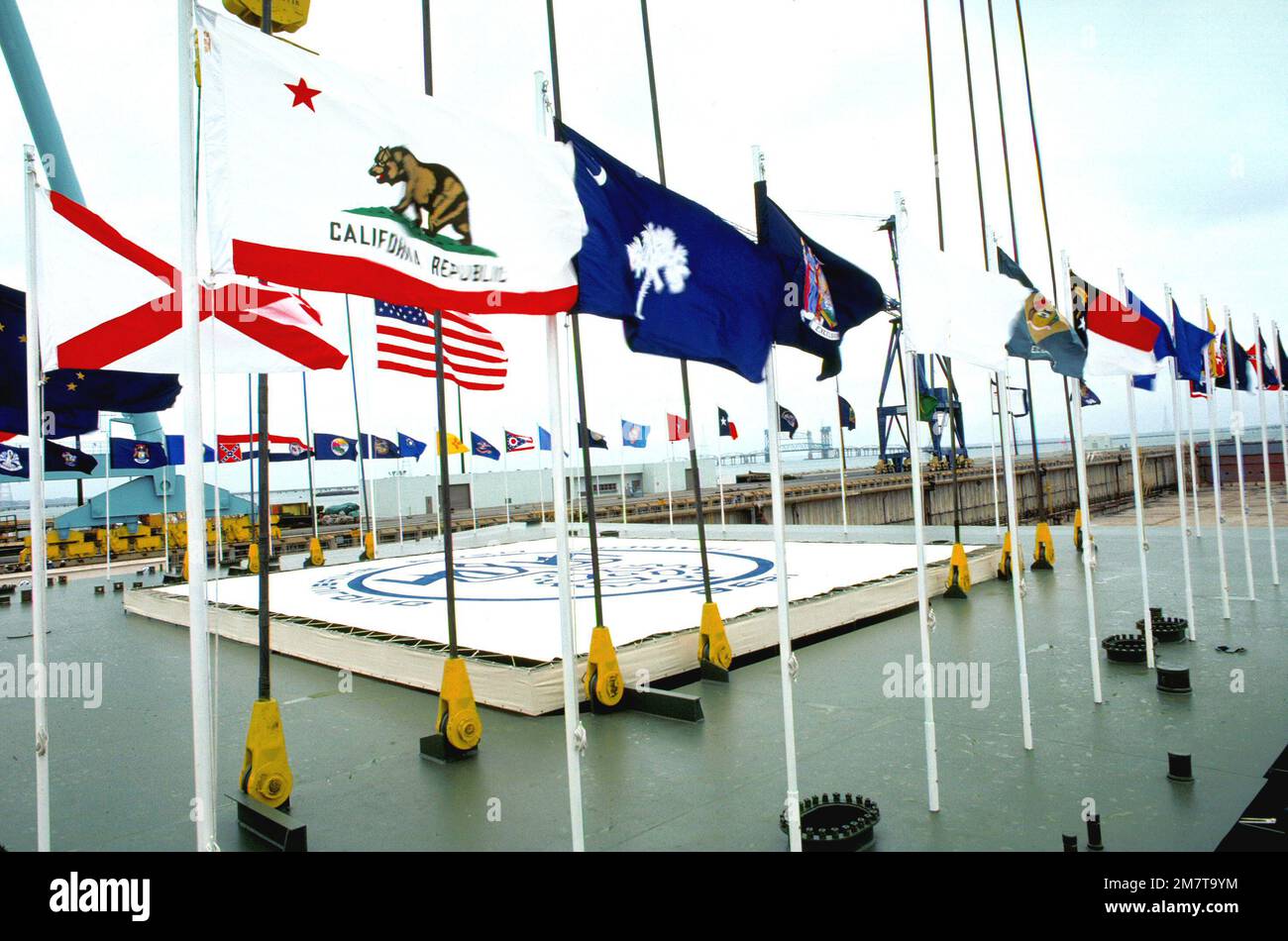 The U.S. flag and state flags line the edge of the first part of the ...
