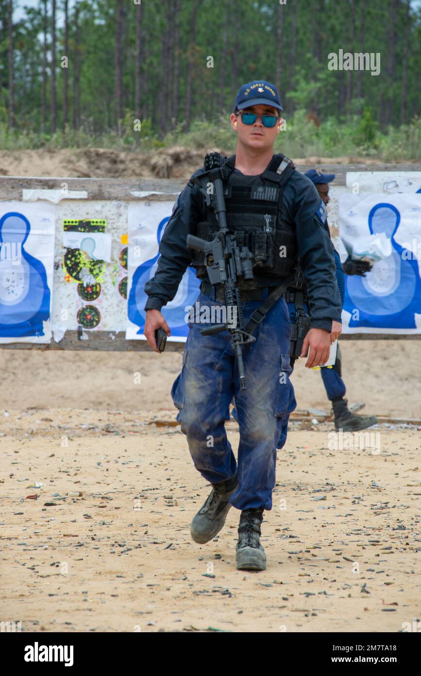 Coast Guard Petty Officer Third Class Hunter Holmes walks away after ...