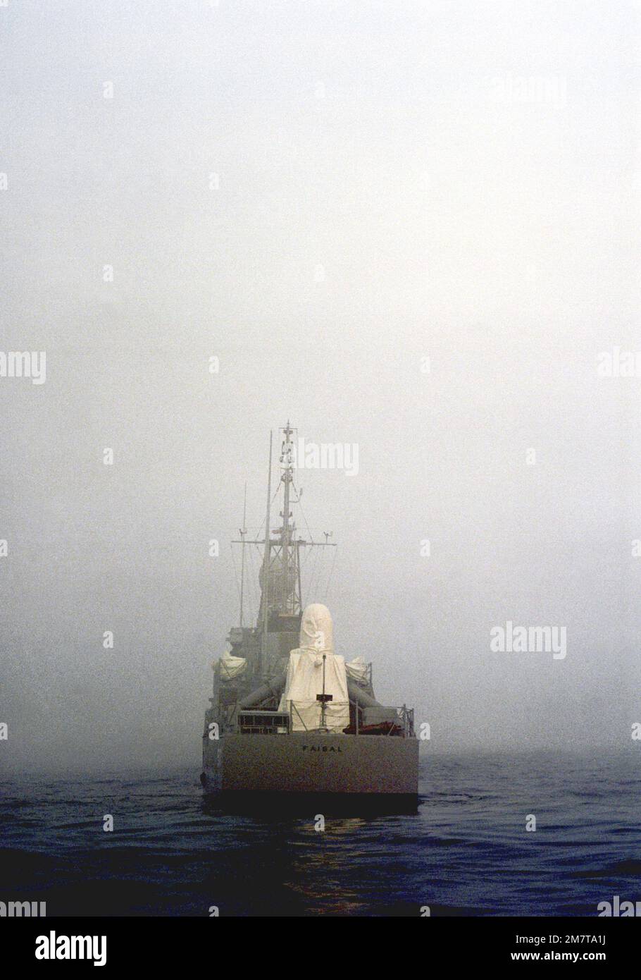 Stern view of the patrol gunboat FAISAL (PGG-517) with weapons covered ...