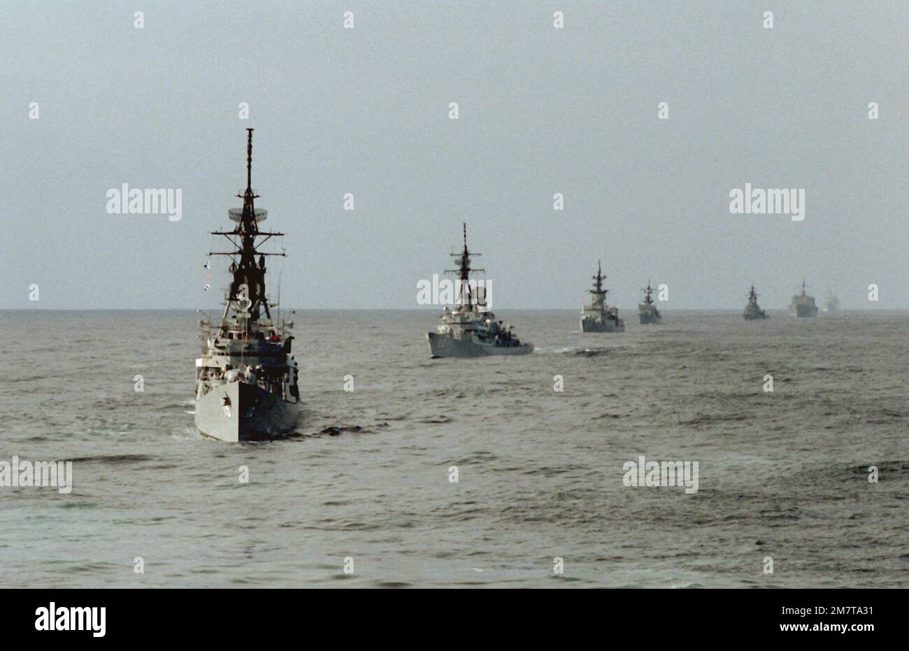 The guided missile destroyer USS JOSEPH STRAUSS (DDG-16) leads a line ...