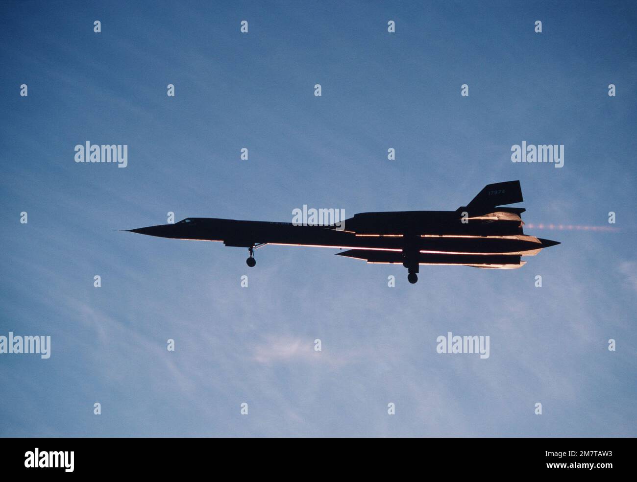 An air-to-air left side view of an SR-71A aircraft. Country: Unknown ...